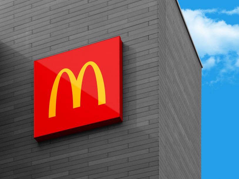 Free Wall Mounted Company Logo Signage Board on Building Mockup PSD ...