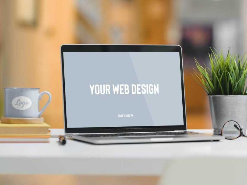 Free Mug & Laptop Website Mockup PSD - Designbolts
