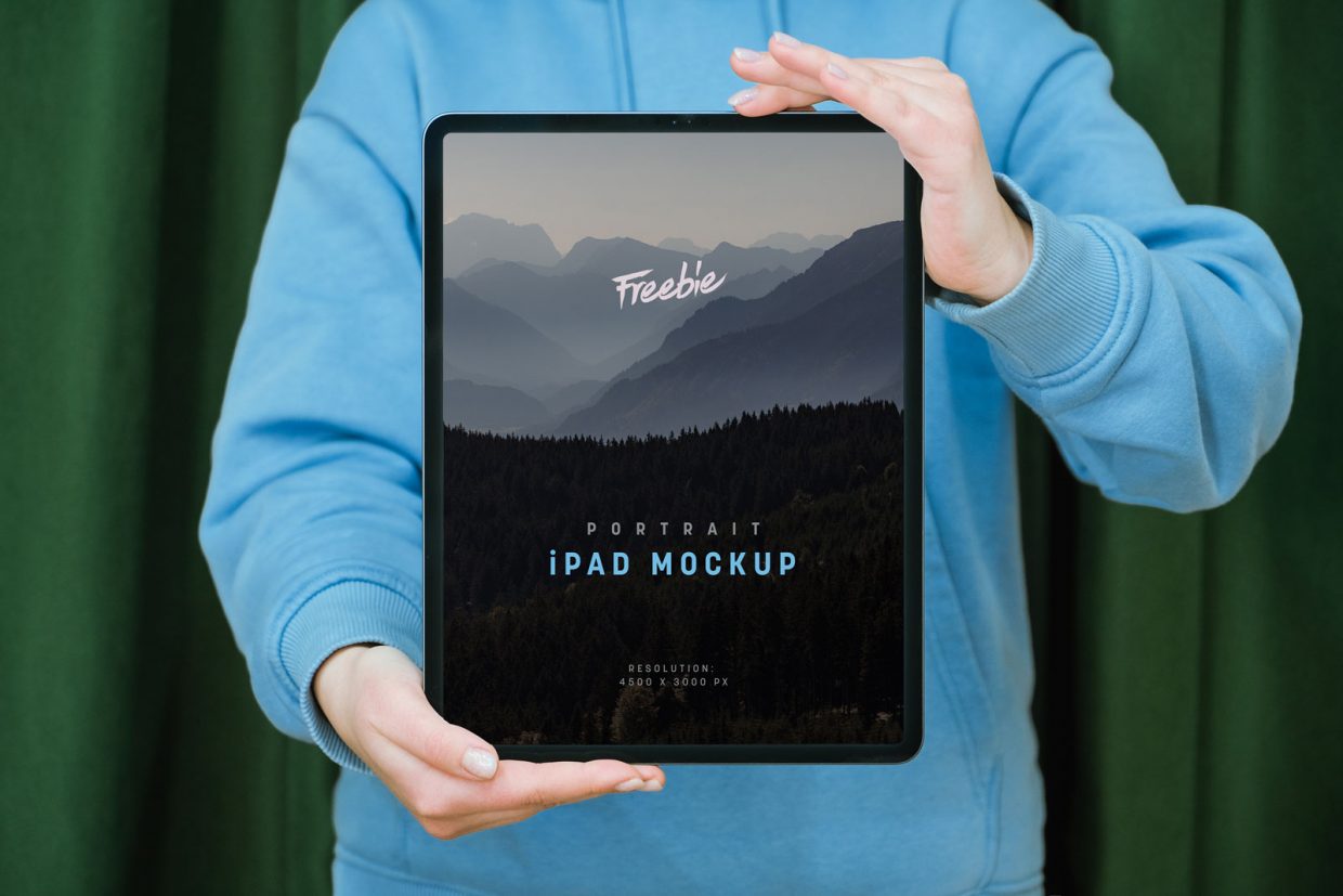 Free Hand Holding iPad Pro Mockup PSD - Designbolts