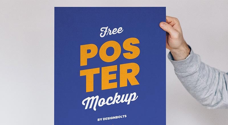 Free Hand Holding Poster Mockup PSD - Designbolts