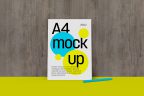 Free Standing Against Wall A4 Flyer Mockup PSD - Designbolts