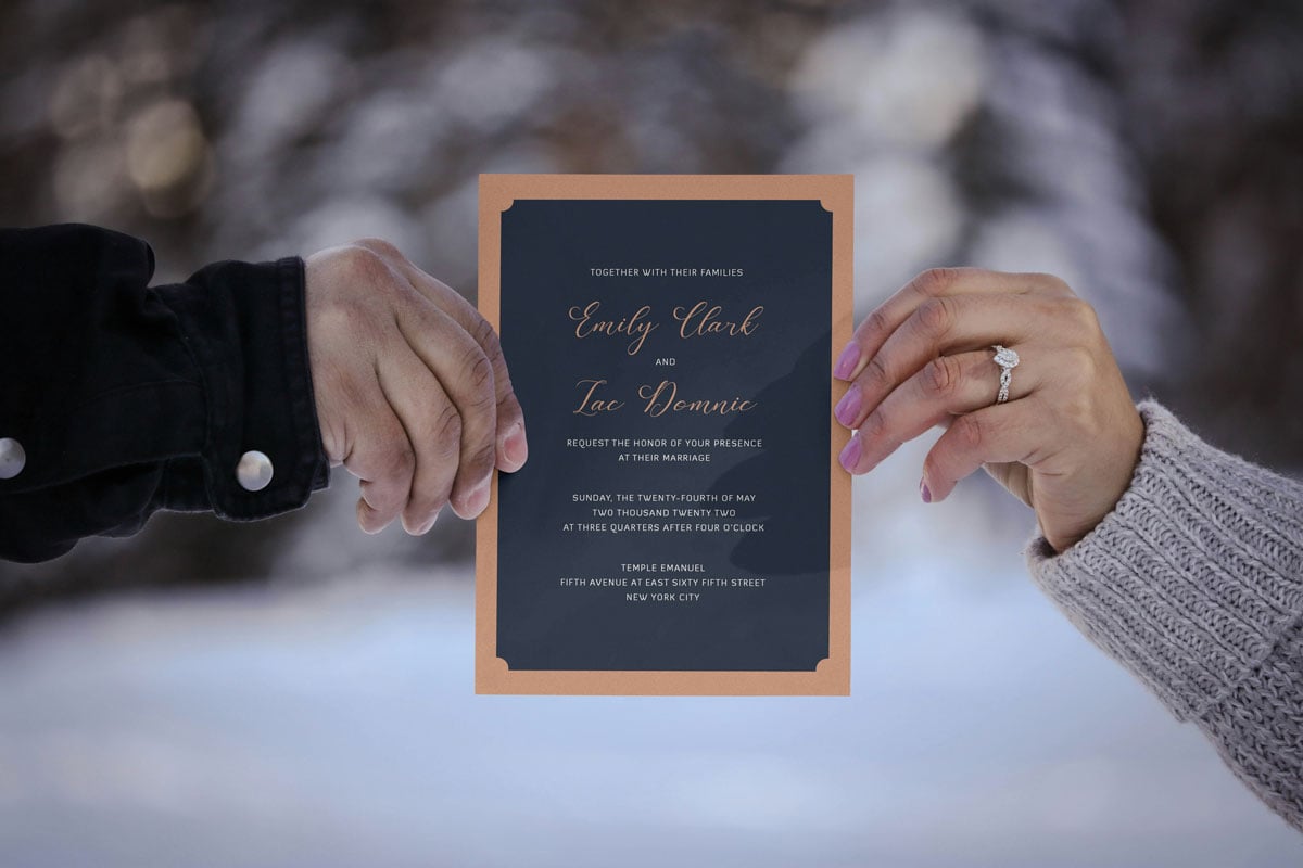 Free Couple Holding Wedding Invitation Card Mockup PSD - Designbolts
